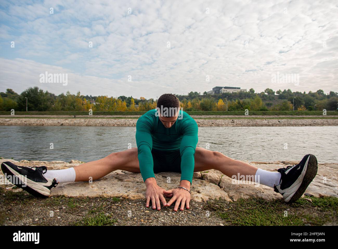 Man stretching by the riverside hi-res stock photography and images - Alamy