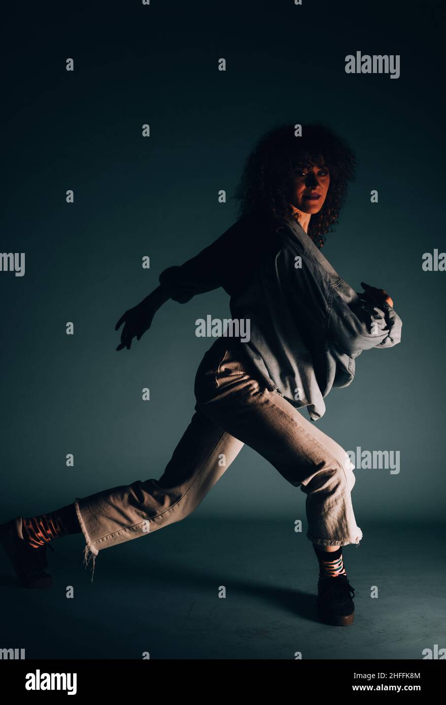Modern dancing performer jumping exercising during a dance practice ...