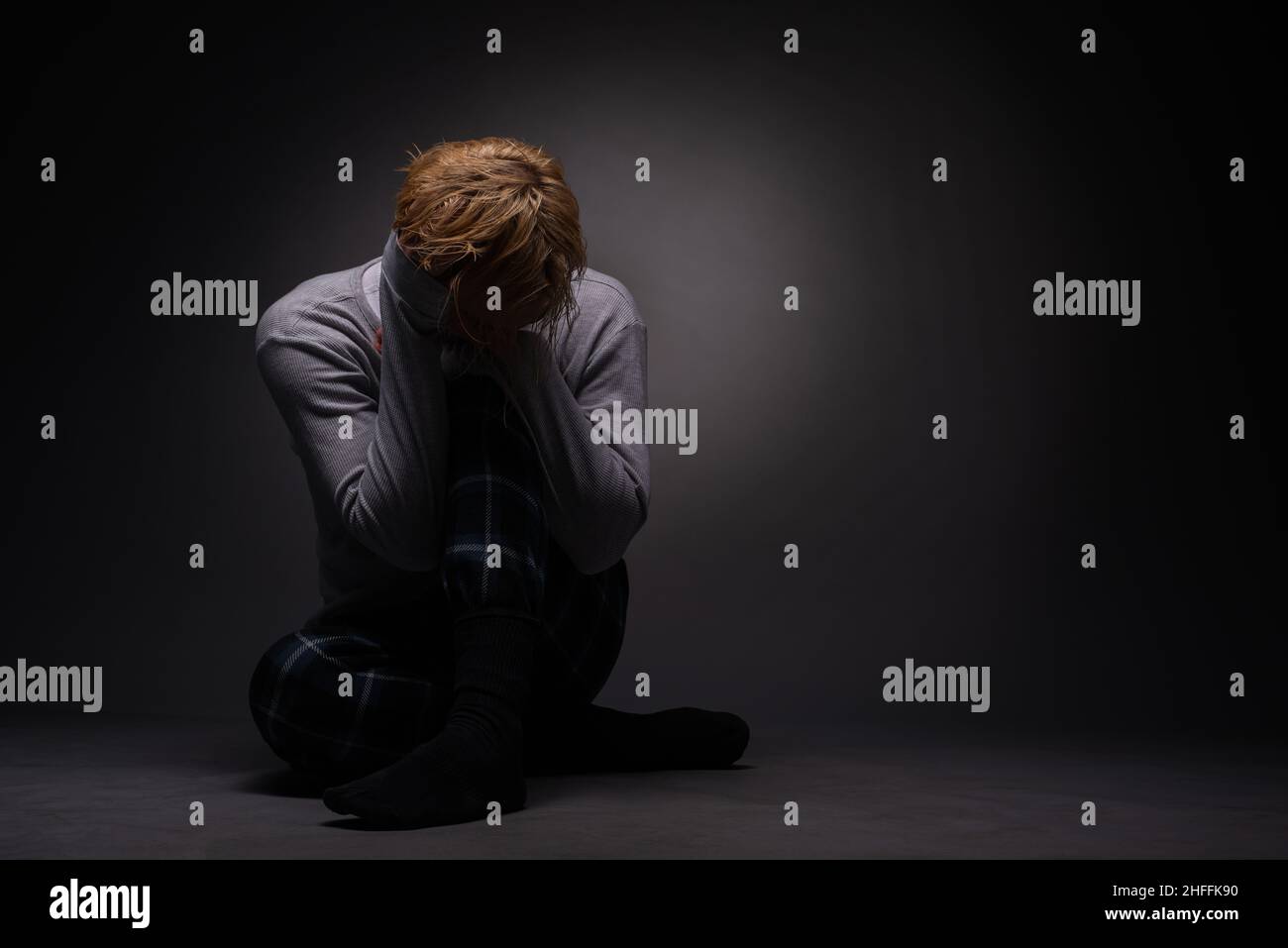 Depressed and sad boy is sitting and crying about the thoughts Stock ...