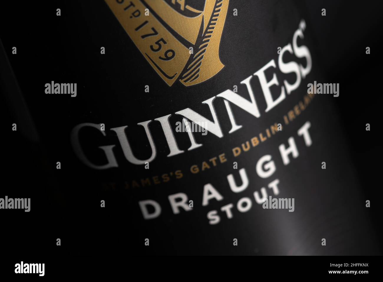 Guinness draught stout can close up detail on black Stock Photo - Alamy