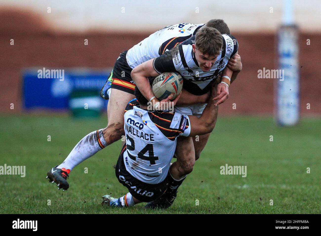 Charlie Severs of Hull City is tackled Stock Photo - Alamy