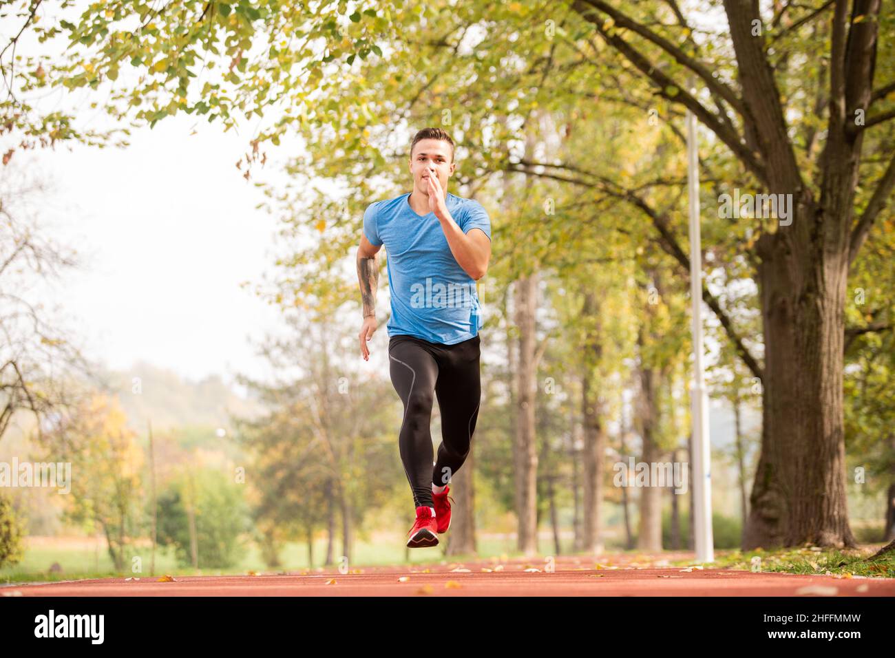 Attractive and handsome guy is running towards the camera alone Stock ...