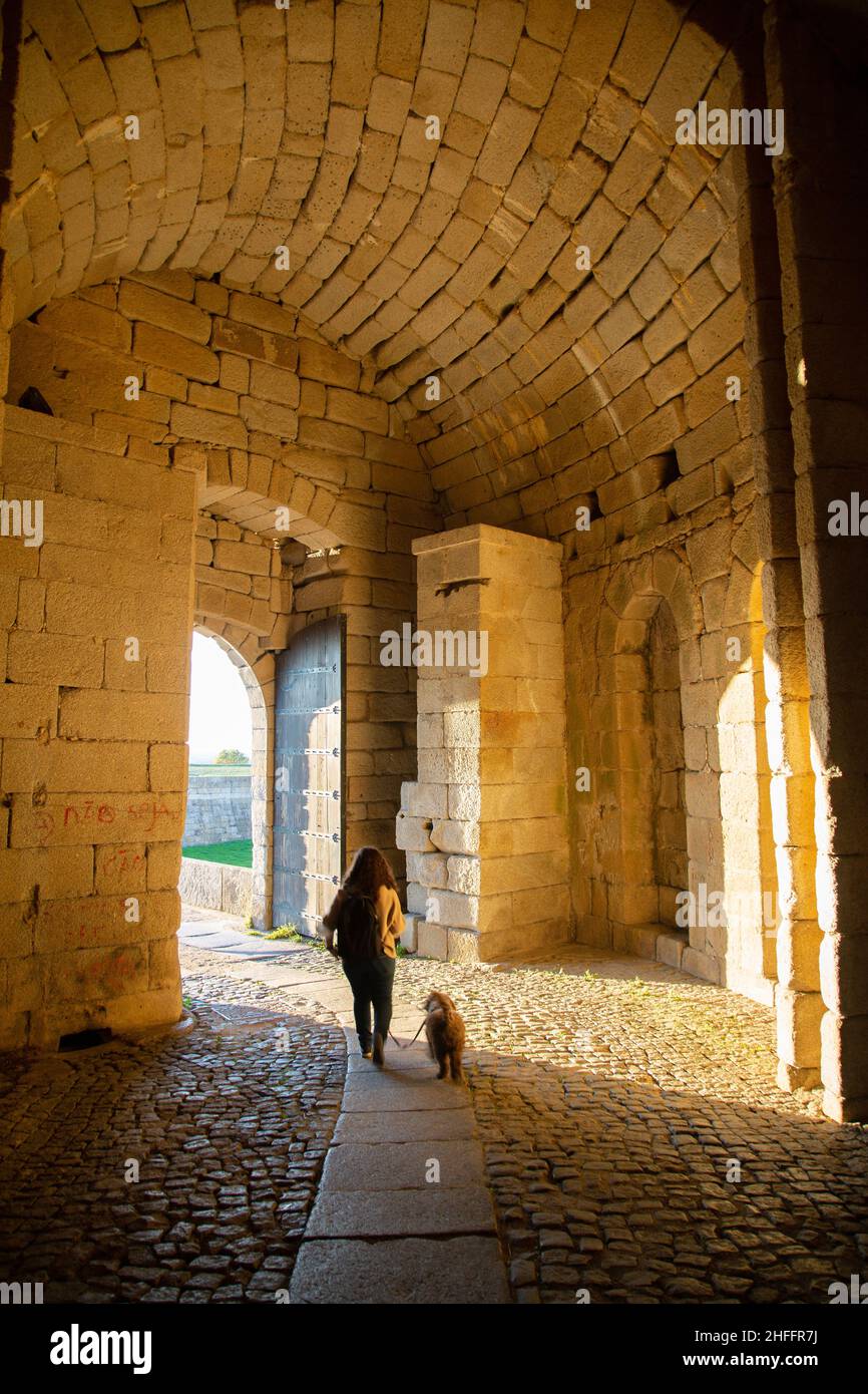 Woman and Dog in Tunnel at Fort Gate, Almeida, Portugal Stock Photo - Alamy