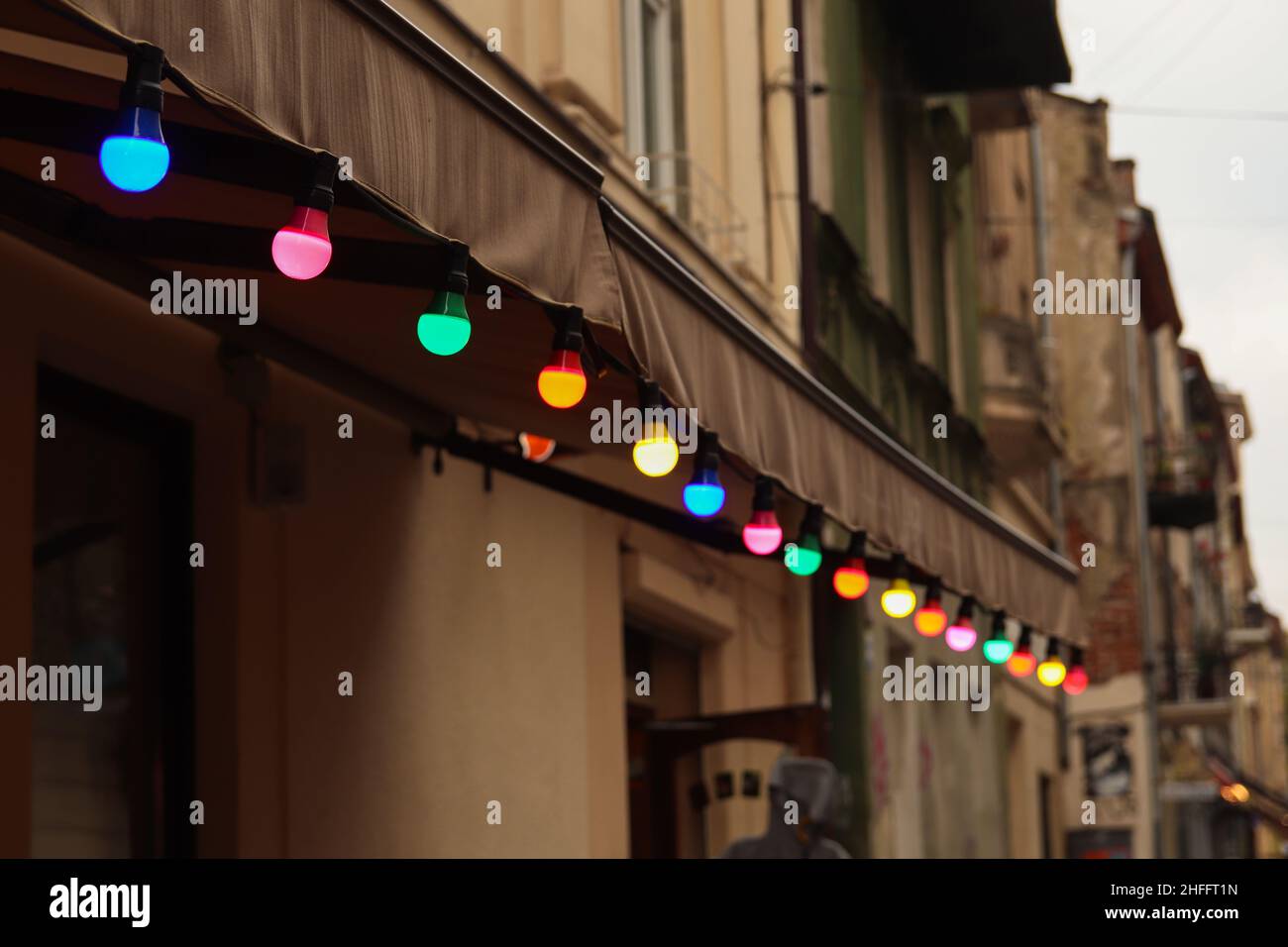 Colorful light bulbs. Abstract blurred background. Classic architecture ...