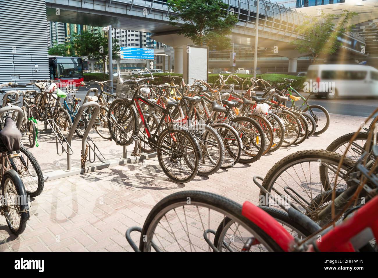 Large bike parking lot in Dubai, lots of bicycles in sunlight, toned ...