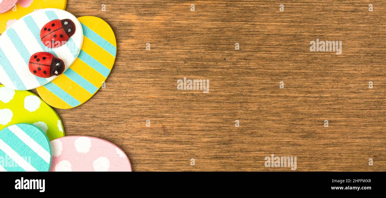 Colorful Easter eggs banner border, old rustic wood background, flat ...