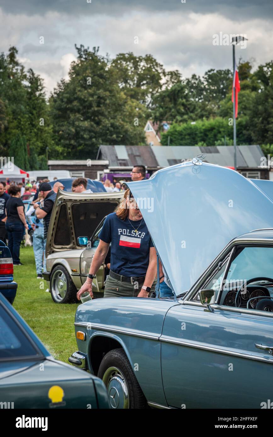 Checking under the hood Stock Photo - Alamy