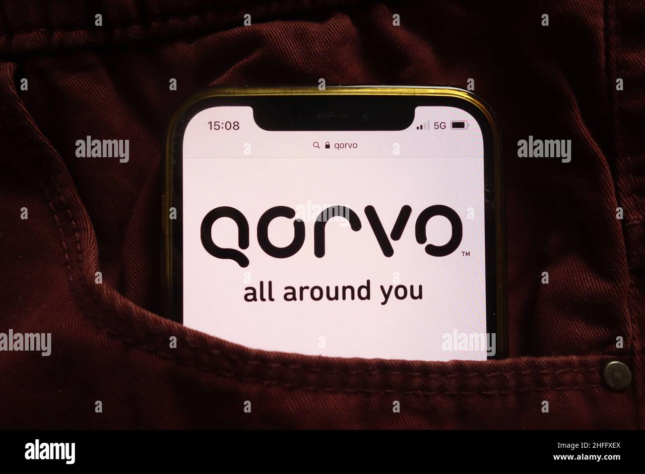 KONSKIE, POLAND - January 15, 2022: Qorvo company logo displayed on mobile phone hidden in jeans ...