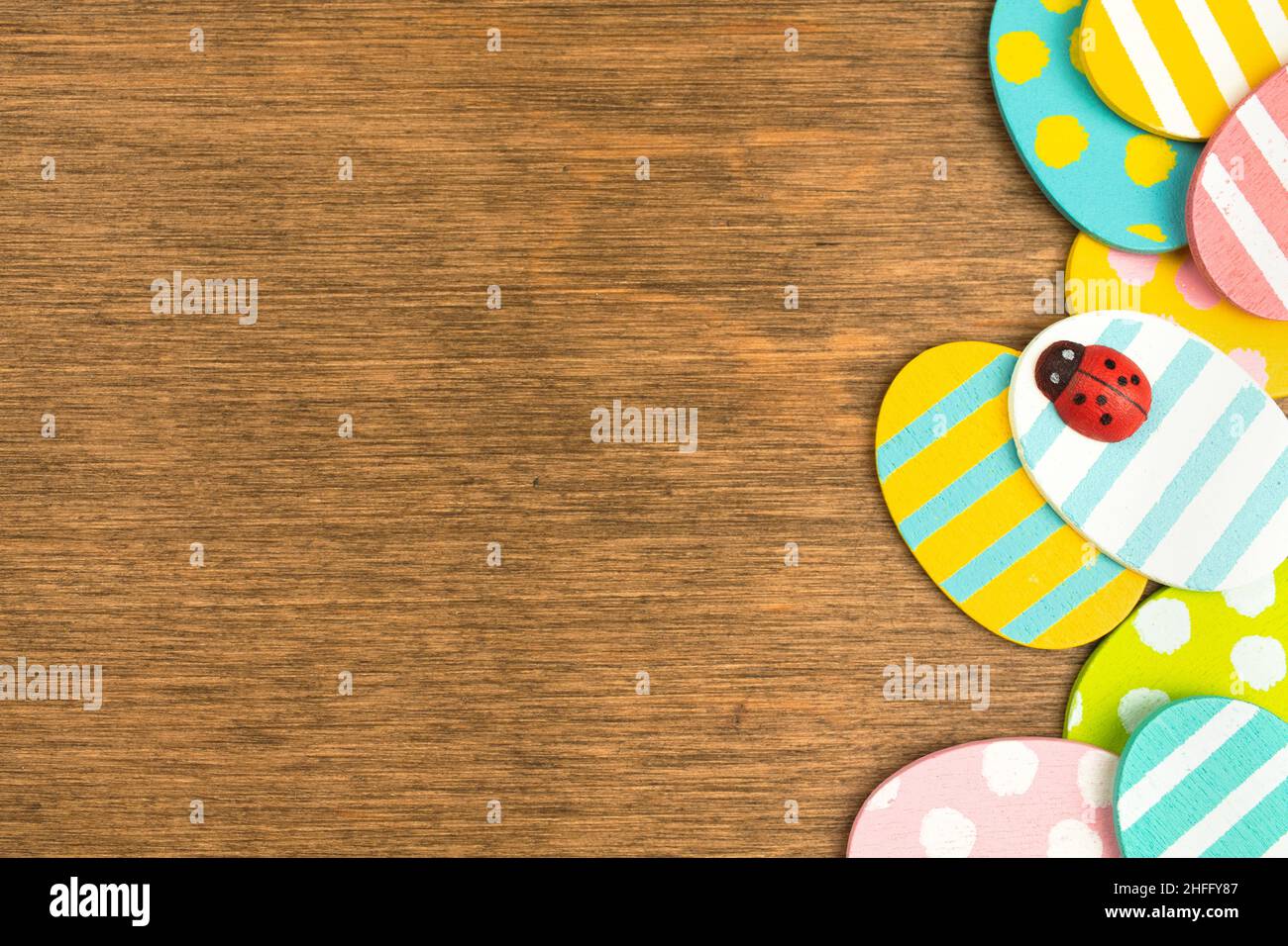 Colorful Easter eggs border, old rustic wood background, flat lay ...
