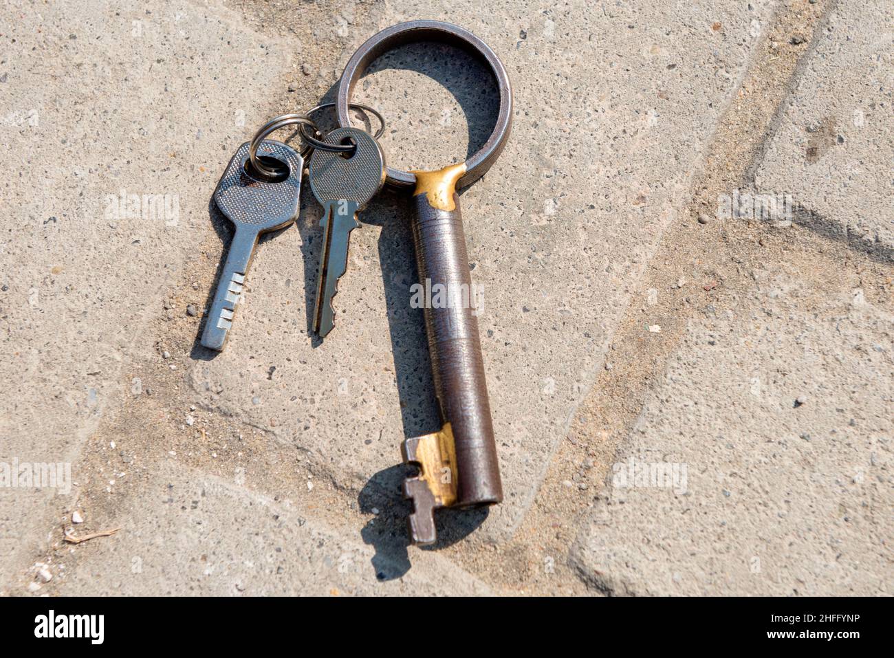 Bunch of keys one big old and several modern Stock Photo - Alamy