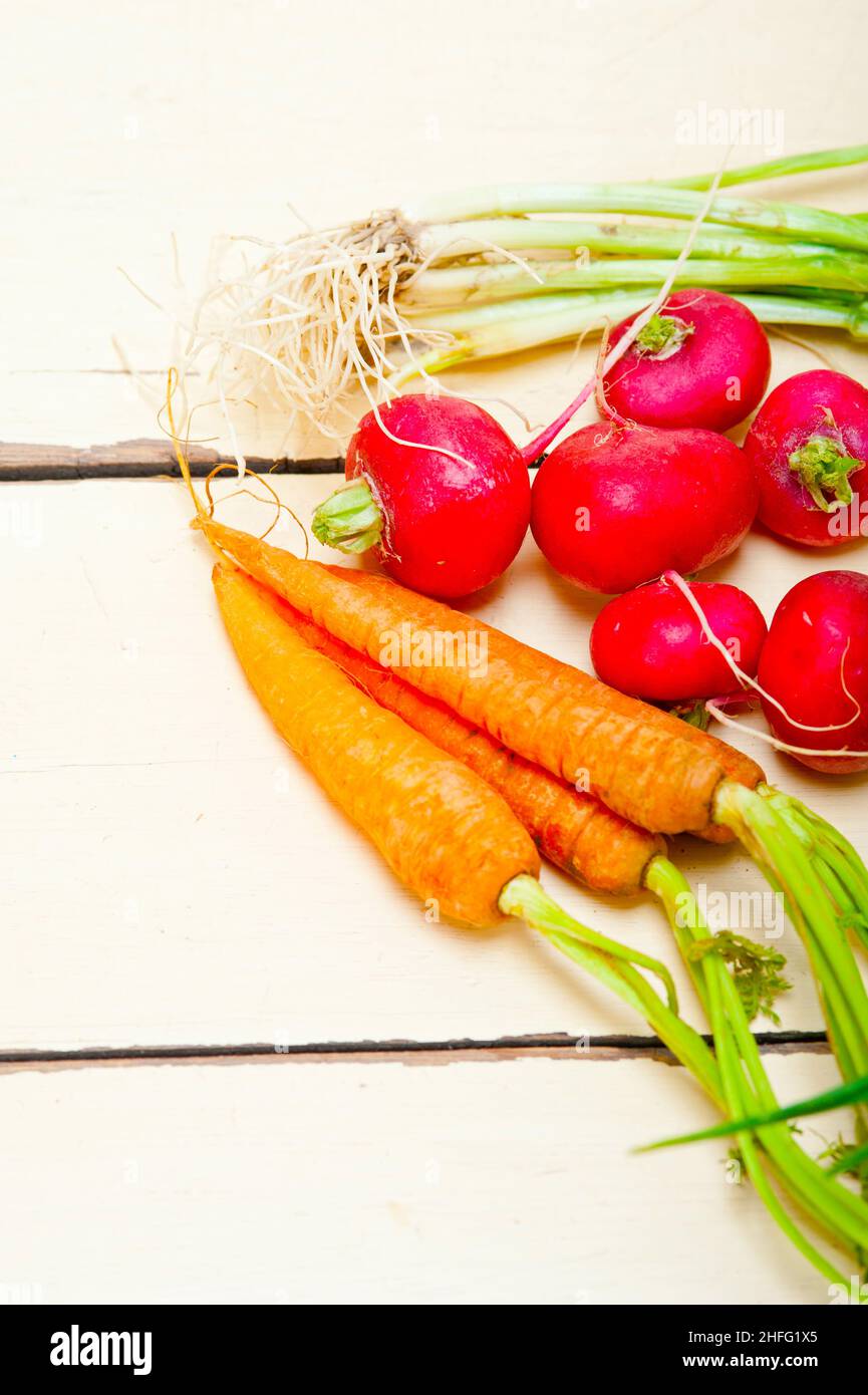 raw root vegetable on a rustic white wood table Stock Photo - Alamy