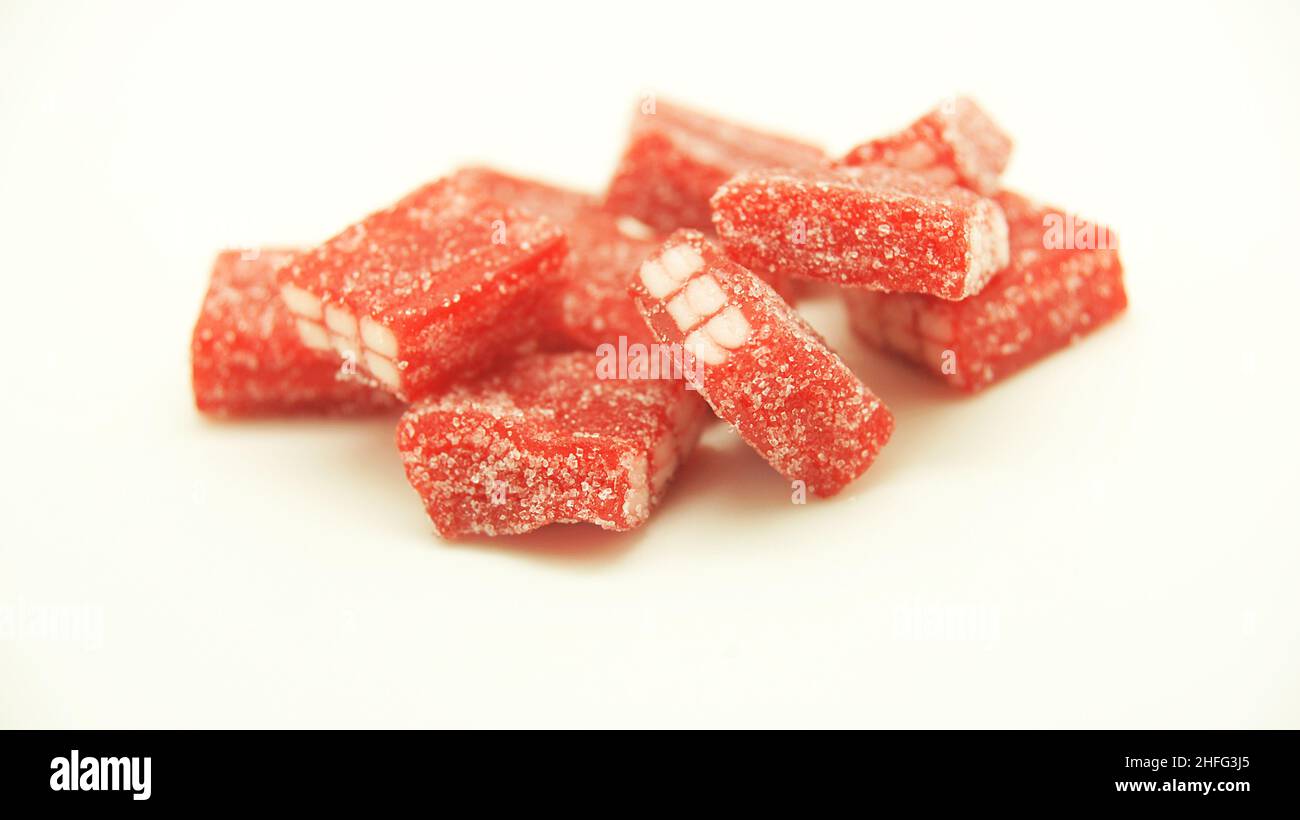 Candies in the form of bricks on white background Stock Photo - Alamy