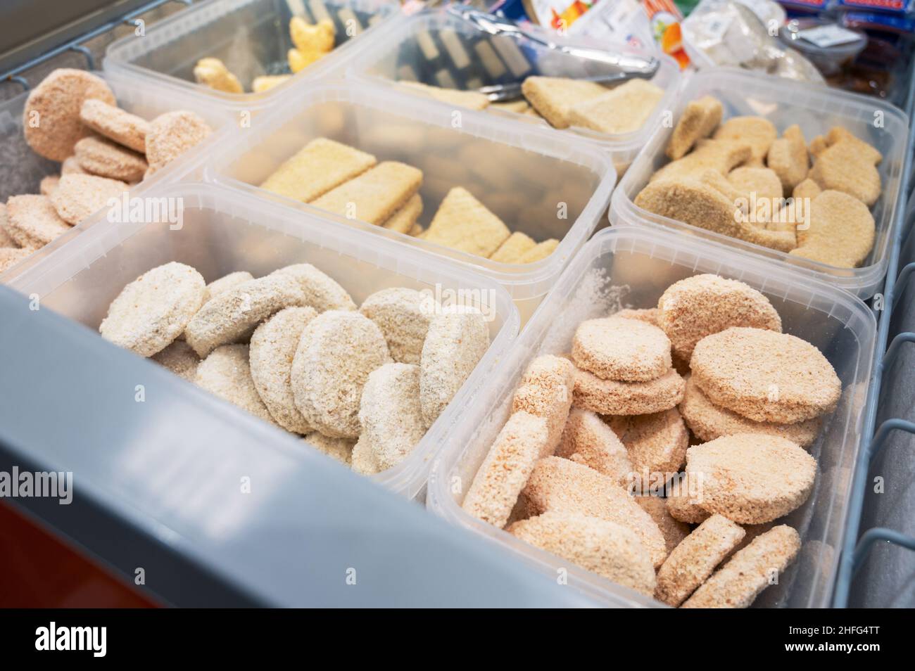 Frozen fish semifinished in fridge at the fish market. Healthy eating ...