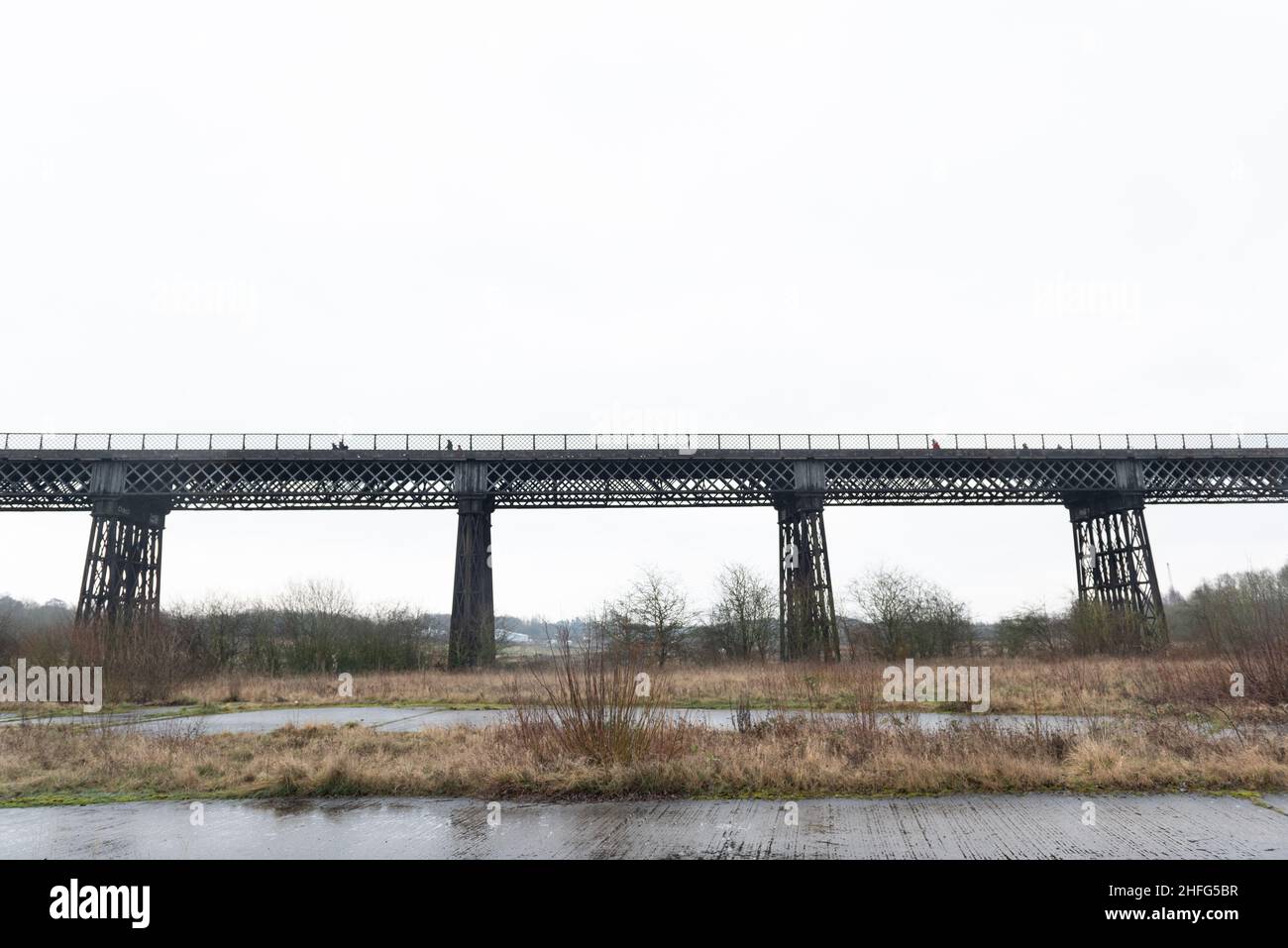 The restored Bennerley viaduct with figures walking across Stock Photo ...