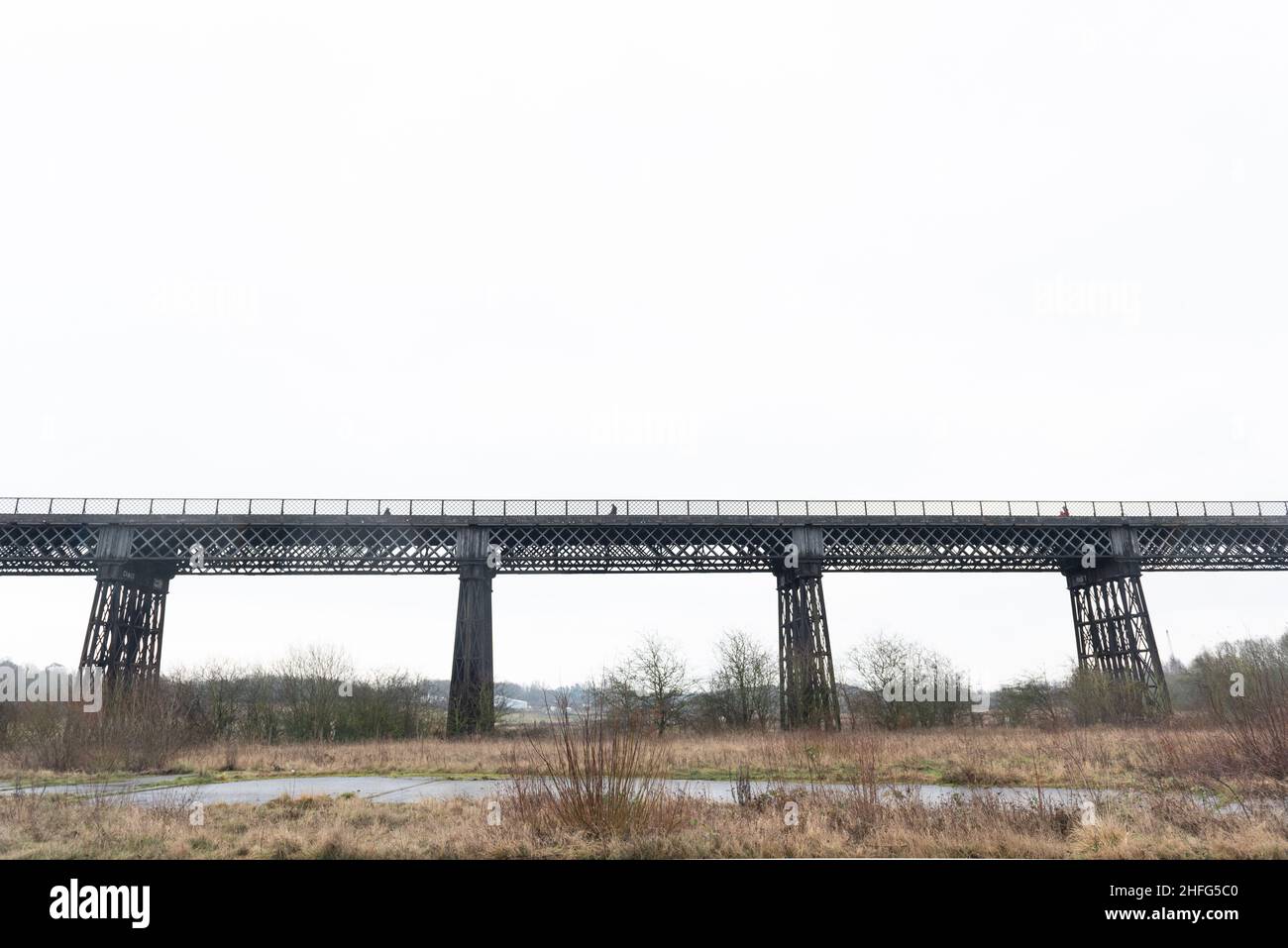 The restored Bennerley viaduct with figures walking across Stock Photo ...