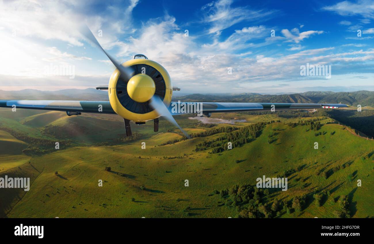 Small aircraft flying above in the blue sunset sky Stock Photo - Alamy