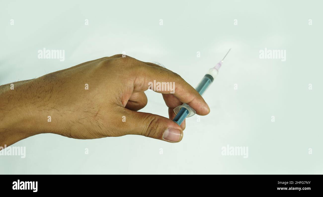 injection in hand on white background Stock Photo - Alamy