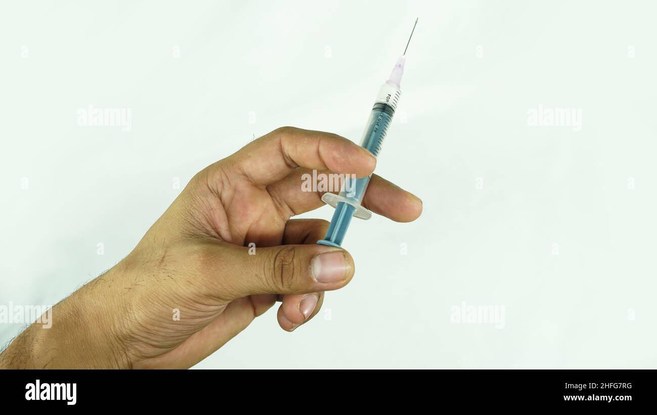 injection in hand on white background Stock Photo - Alamy