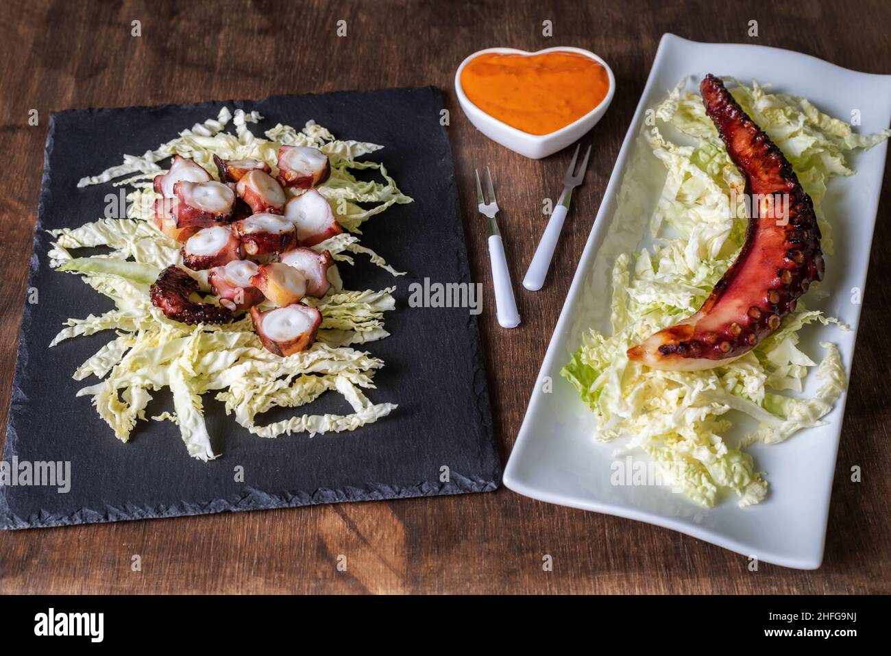 Dry octopus legs, dried according to tradition, served on a bed of ...