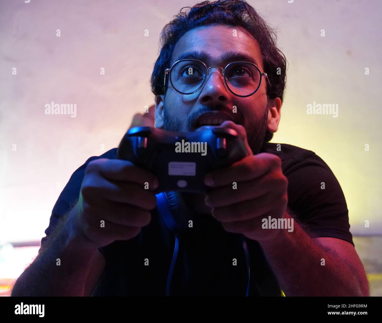 exited man using playing video game using gaming wireless joystick ...