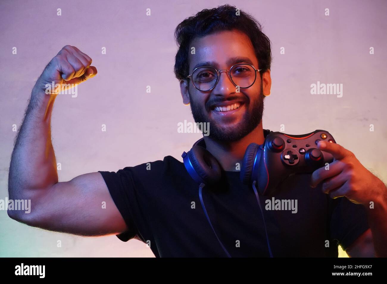 exited man showing his body and going for play video game using ...