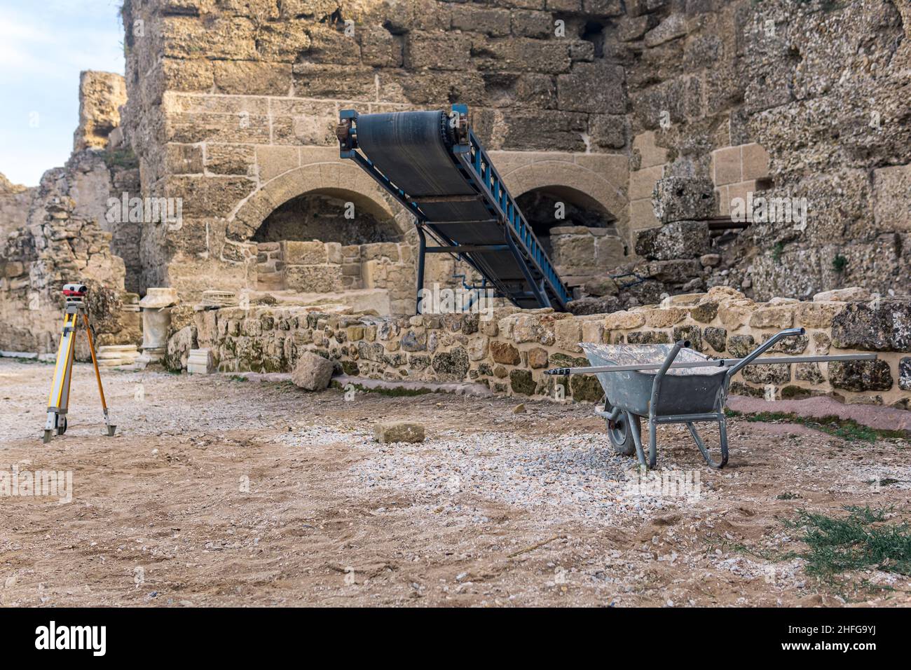 archaeological site among antique ruins with a conveyor for ground ...