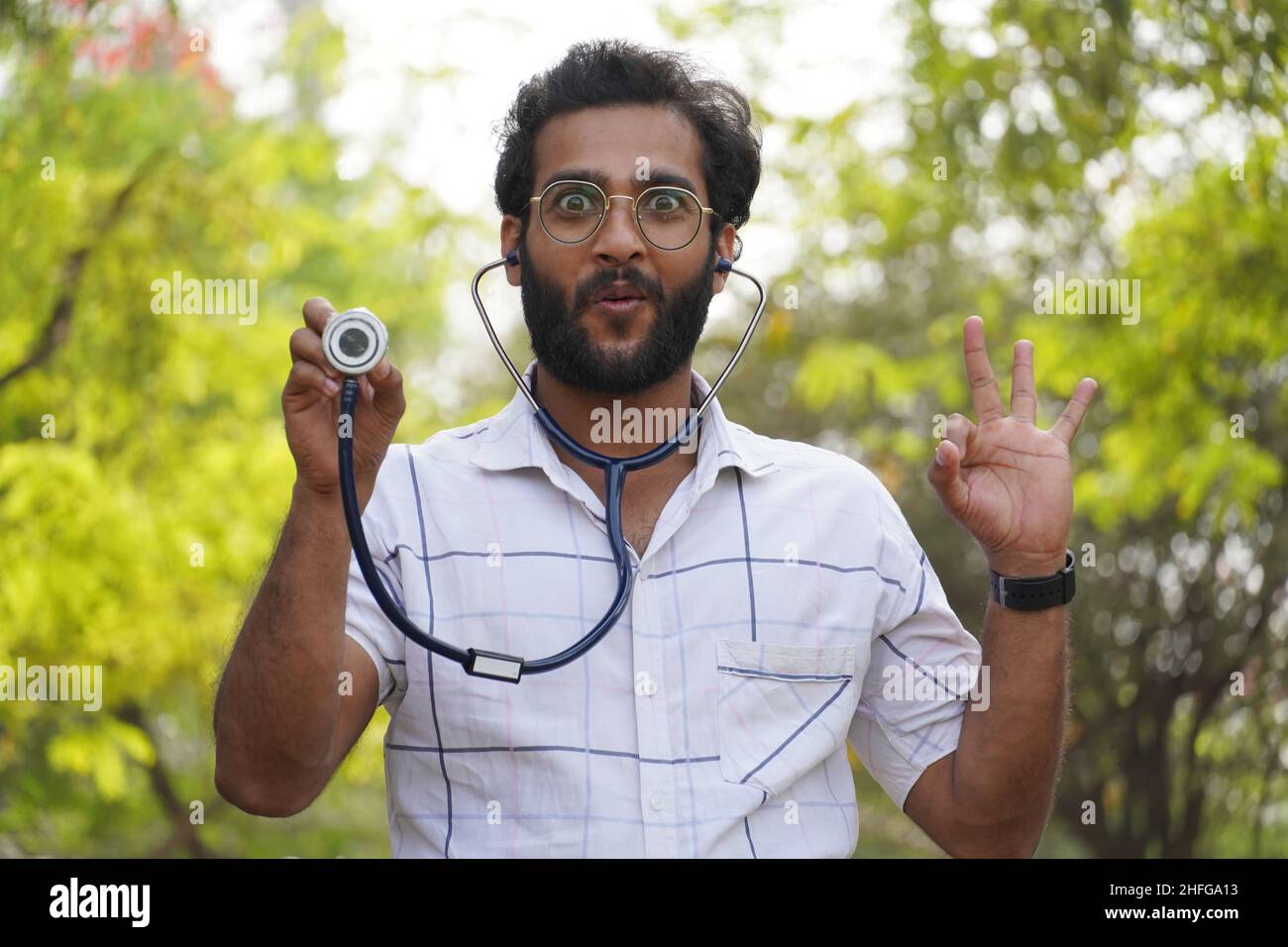 A exited student showing stethoscope- college student with stethoscope ...