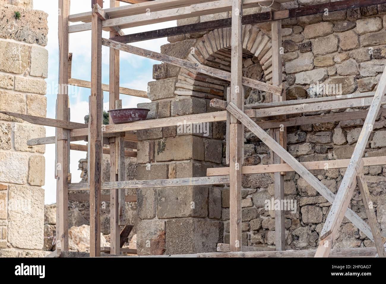 wooden scaffolding around a restored antique building Stock Photo - Alamy