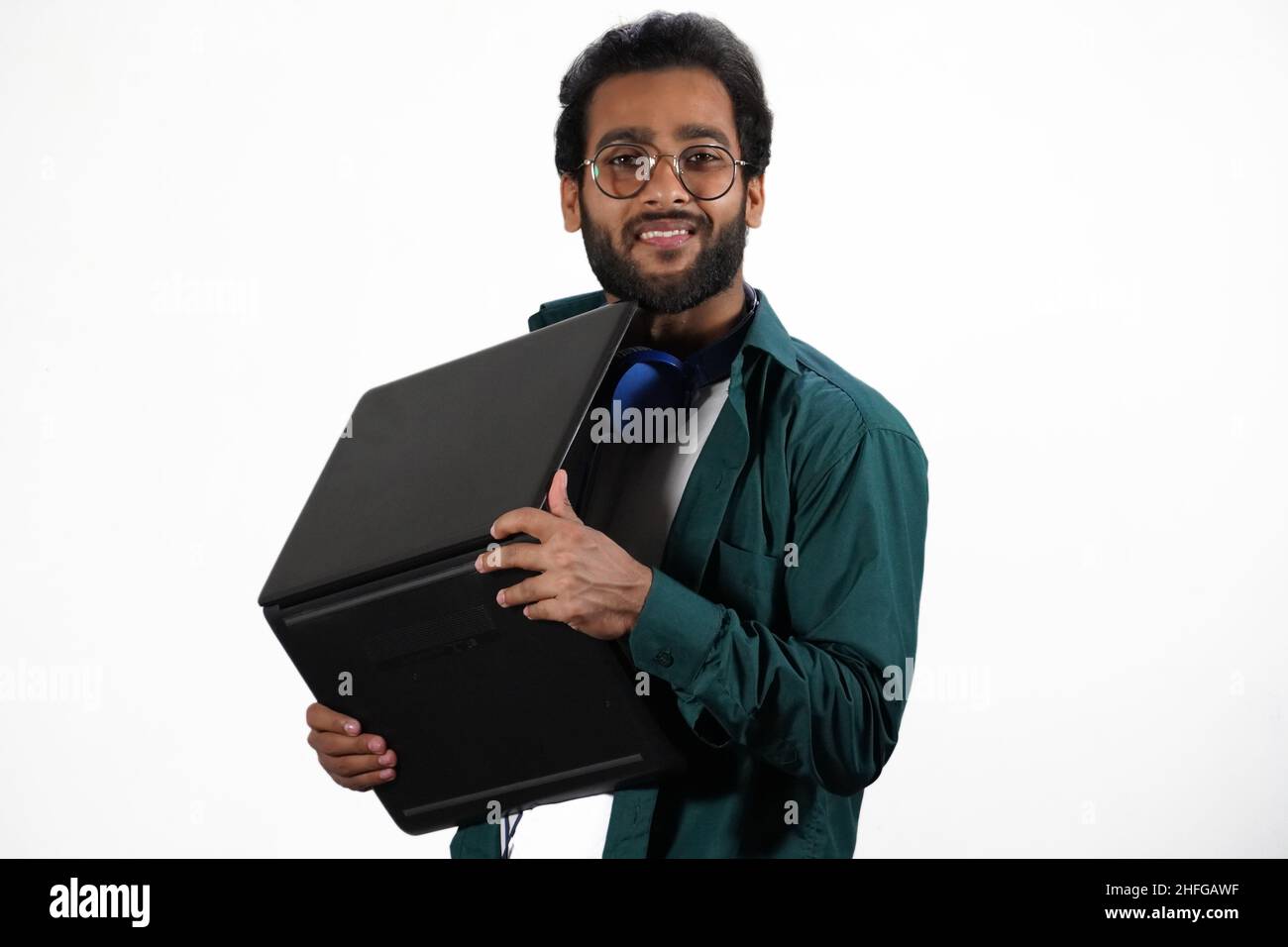 A Young man with laptop and Headphone - online Education Concept , in ...