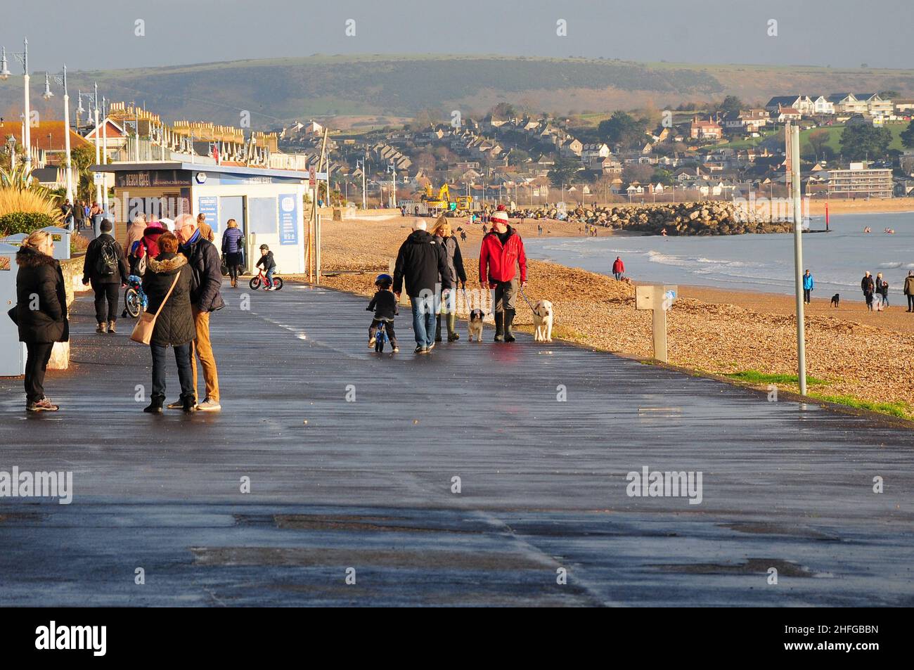 Weymouth. 16th January 2022. People enjoy a showery day at the beach ...