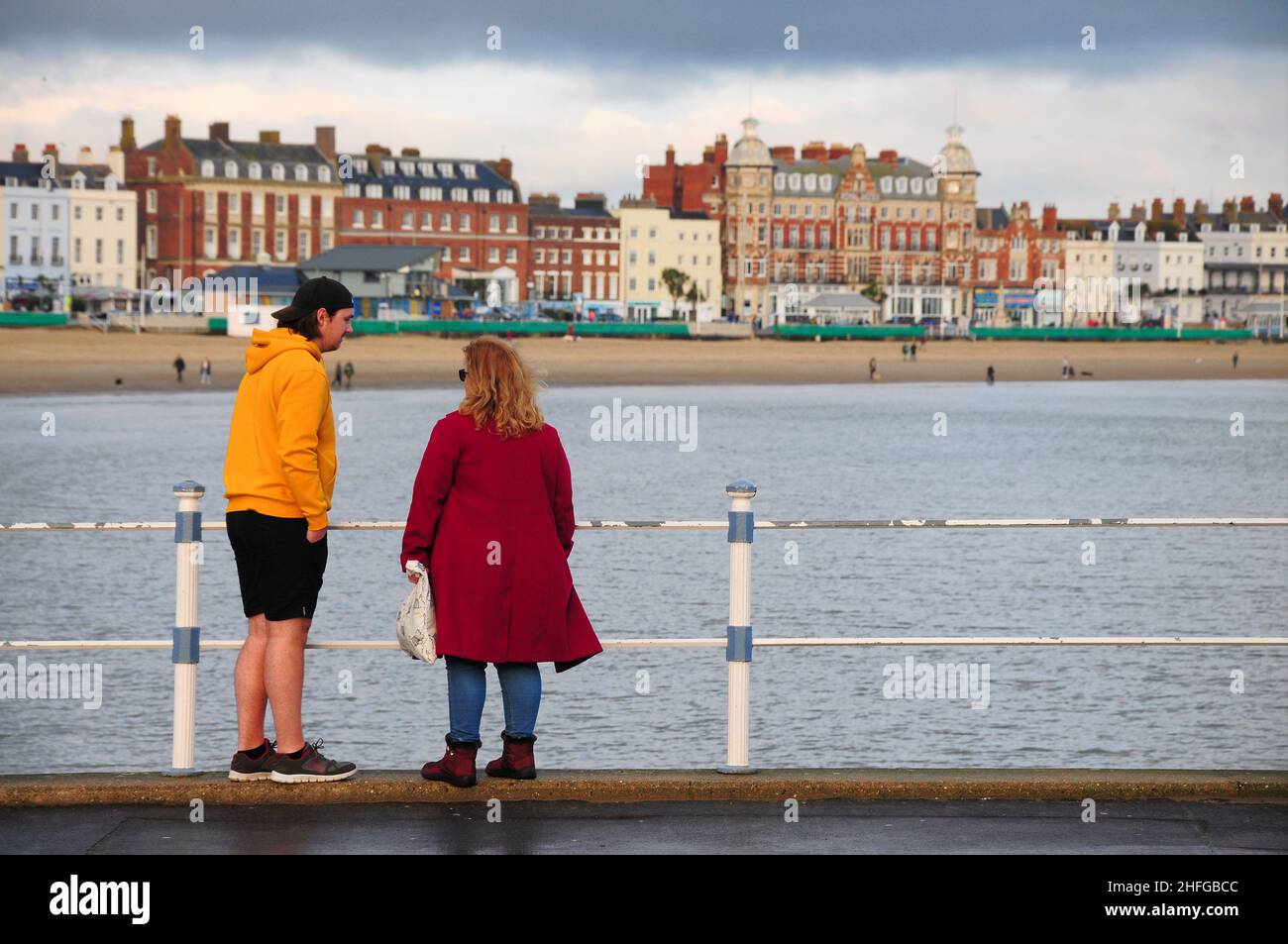 Weymouth. 16th January 2022. People enjoy a showery day at the beach ...