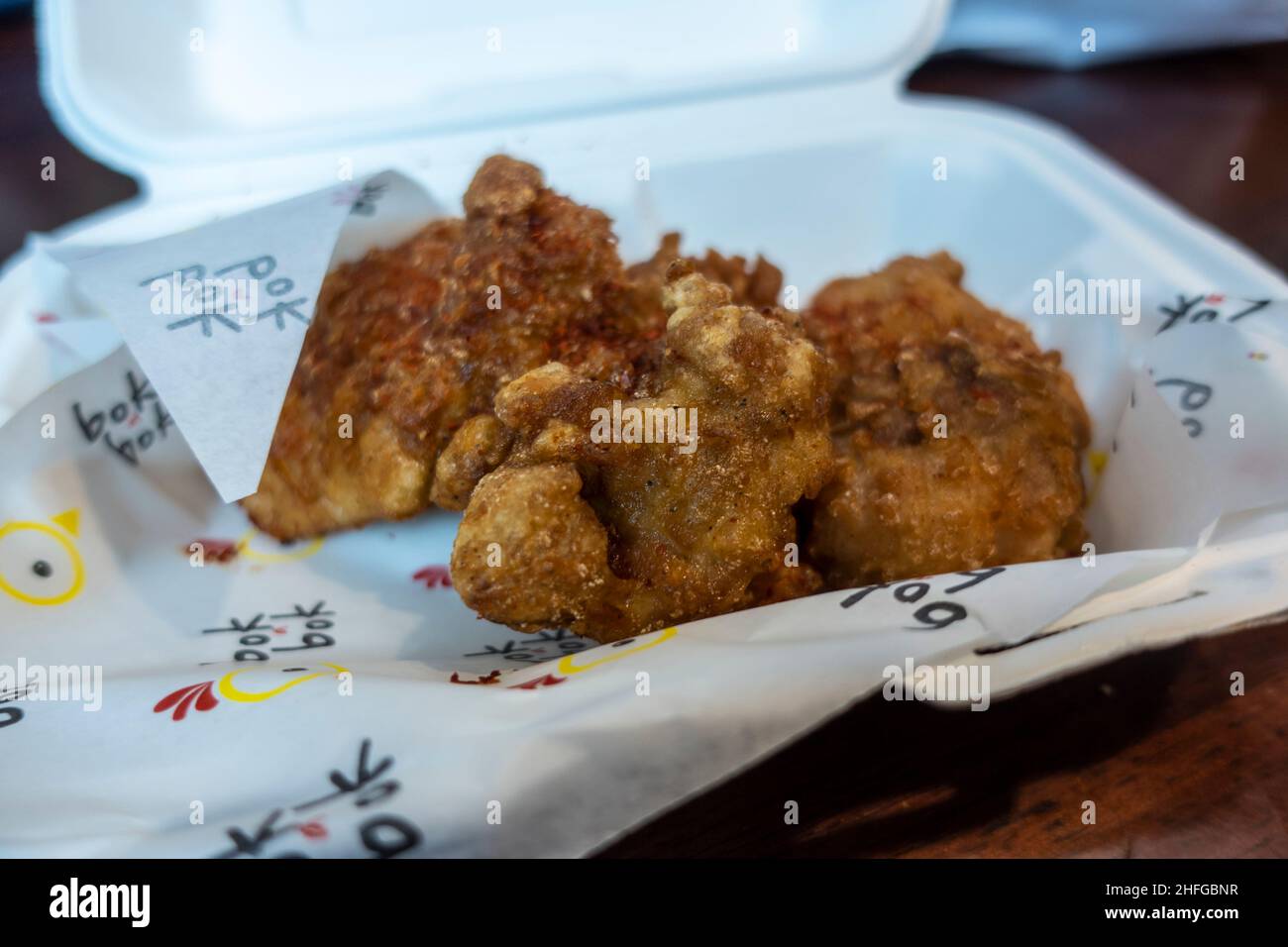 Seattle, WA USA - circa December 2021: Selective focus on fried chicken ...