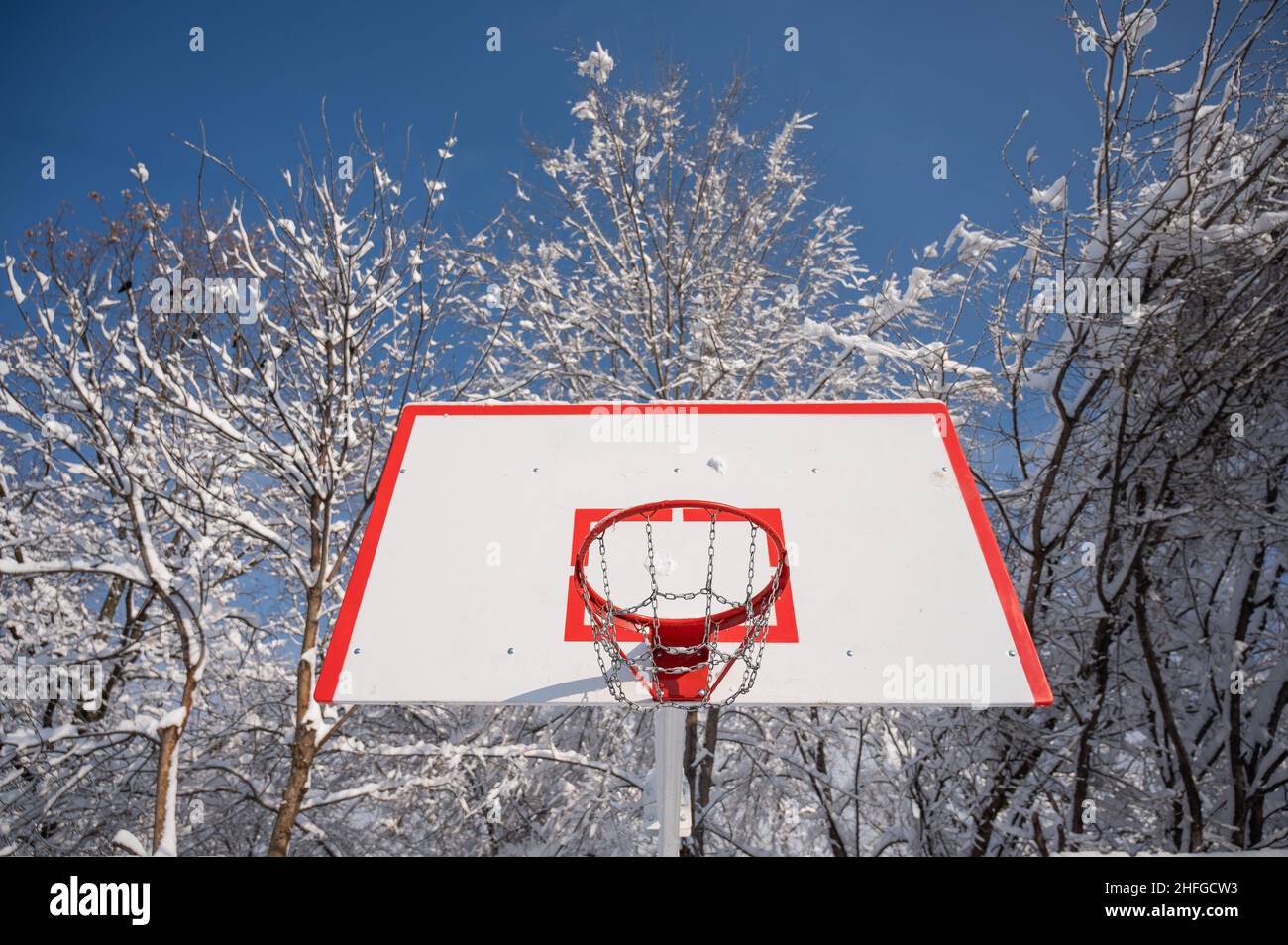 Basketball hoop in the snow in winter Stock Photo - Alamy