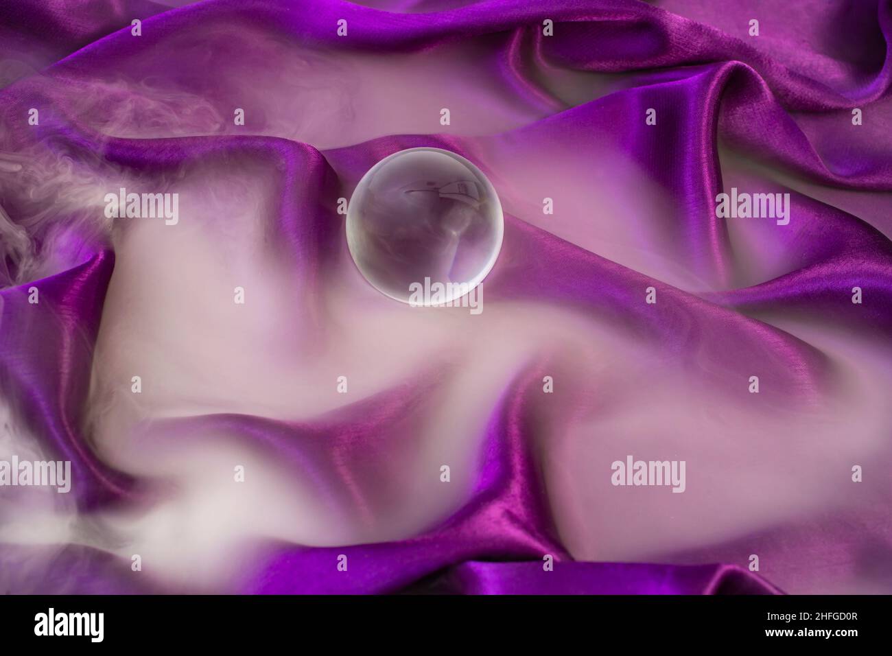 lens ball levitating on a purple satin and mist background Stock Photo ...
