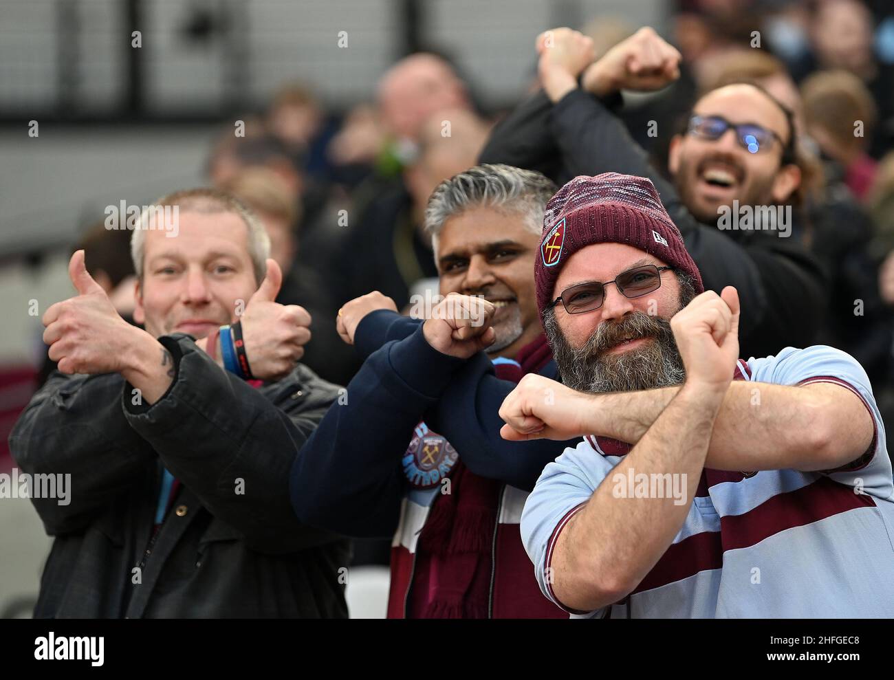 London, UK. 1st Jan, 2022. Fans make the crossed hammers sign before ...