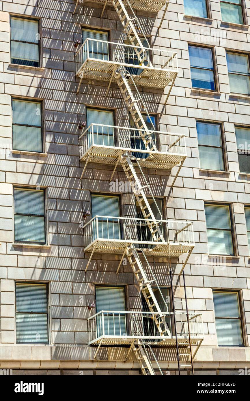 facade of historic skyscraper downtown Los Angeles with fire escape ...