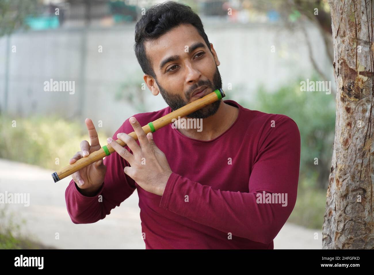 A man playing the flute Stock Photo - Alamy