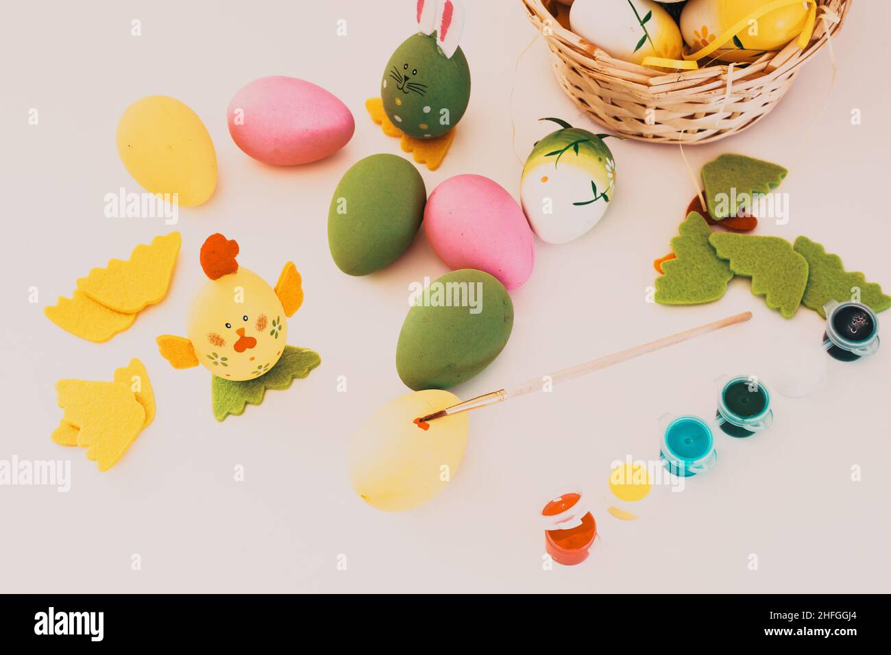 painting Easter eggs and bunnies Stock Photo - Alamy