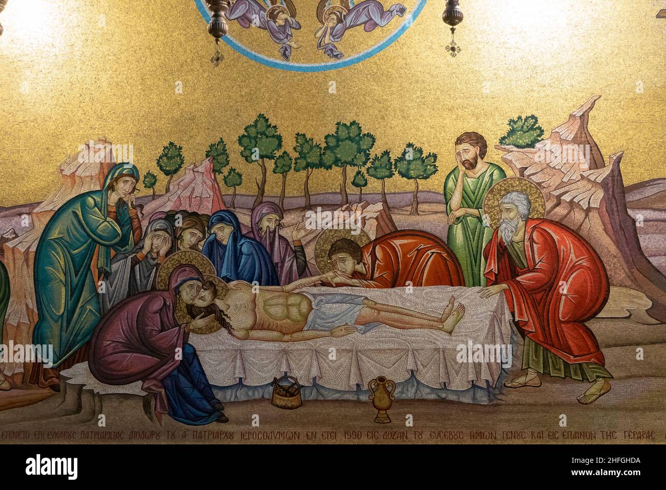 A wall mosaic depiction of Jesus Christ's body being prepared after his ...