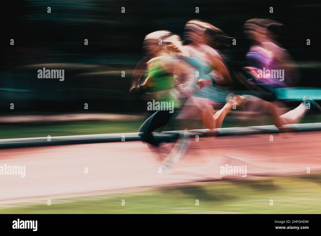 blurred image of runners in a competition Stock Photo - Alamy