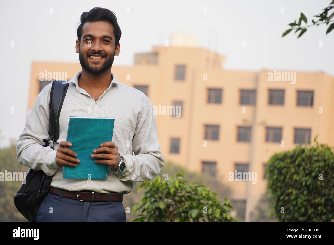 young Student Standing outside of school Stock Photo - Alamy