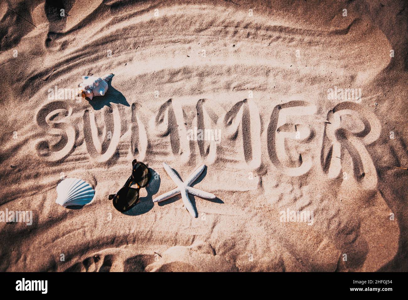 summer written in sand beach holiday Stock Photo - Alamy