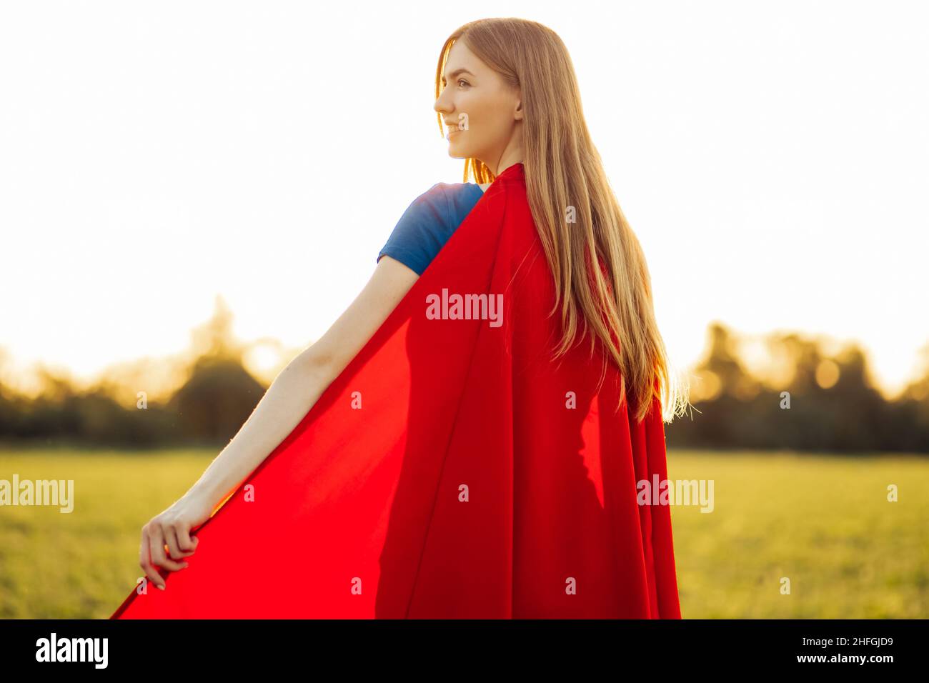 Photo from the back Woman superhero. blonde in the image of a ...