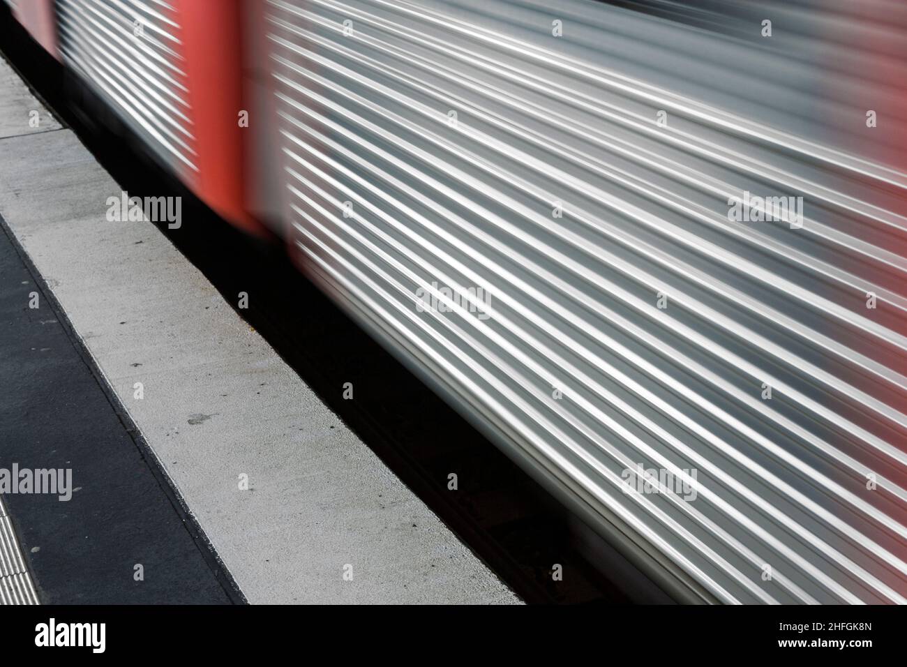 detail of train in speed passing the platform Stock Photo - Alamy