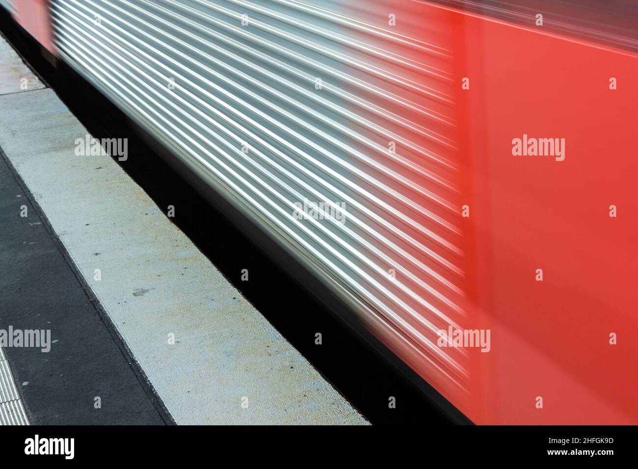 detail of train in speed passing the platform Stock Photo - Alamy