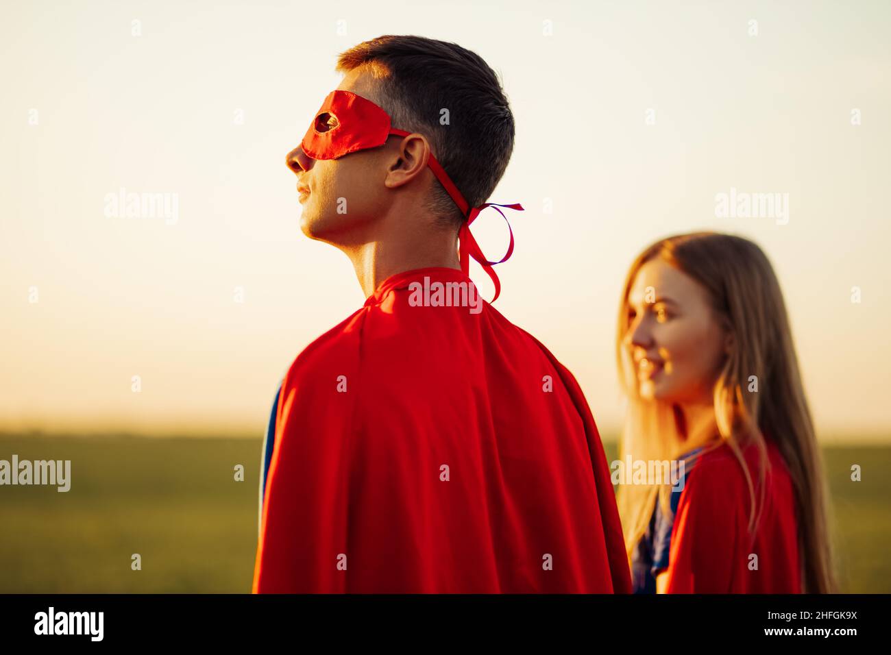 Happy man and woman in superhero costumes, strong successful ...