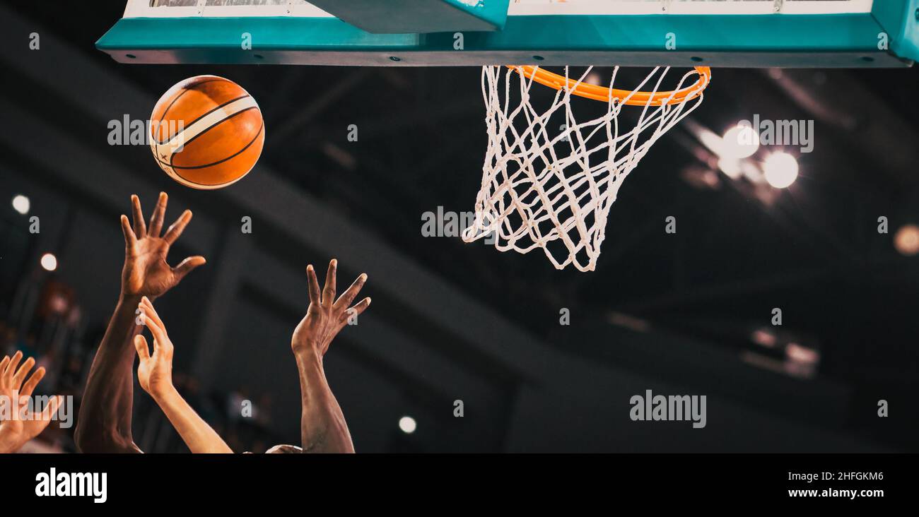 basketball game ball in hoop Stock Photo - Alamy