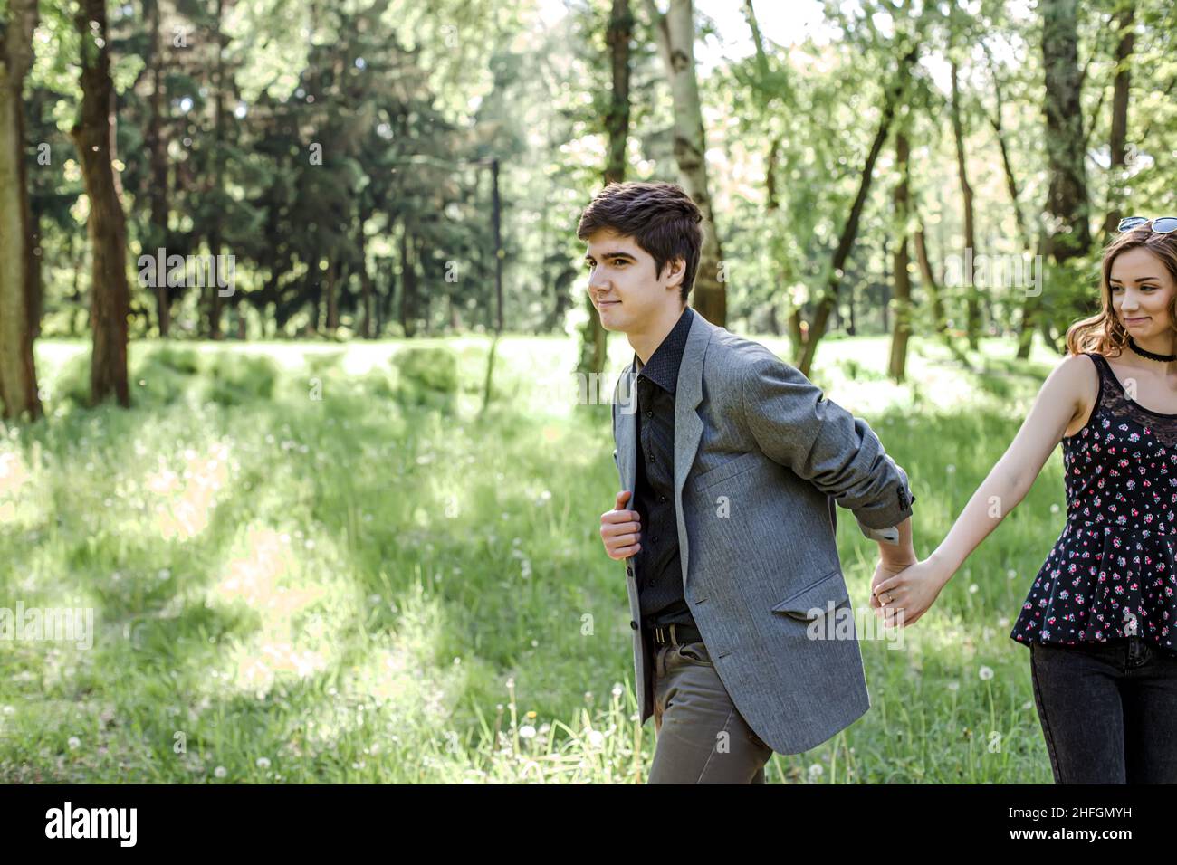 Happy couple on a walk in spring nature. The lifestyle of people of ...
