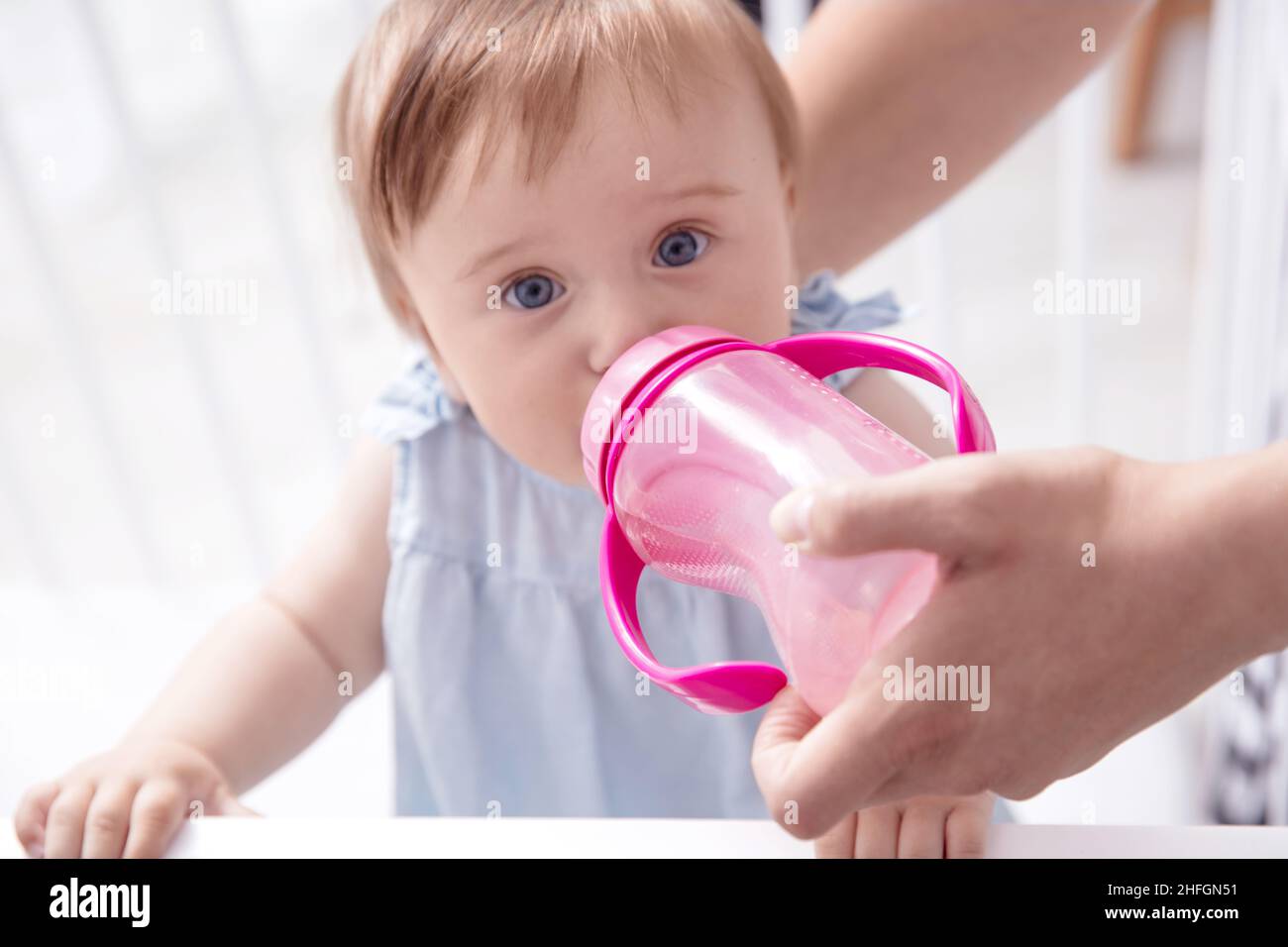 Baby sipping water hi-res stock photography and images - Alamy