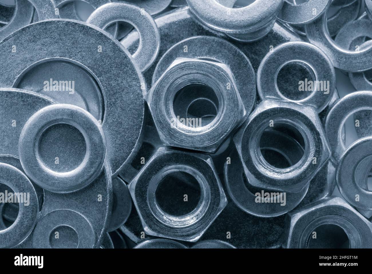 Abstract industrial textured metal background with many metal washers ...